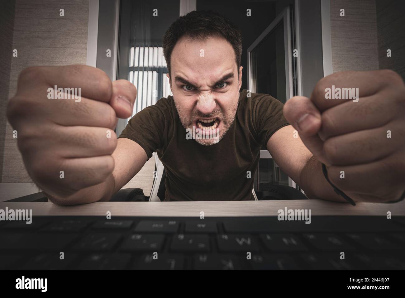 angry man swearing and cursing against information technology and his ...