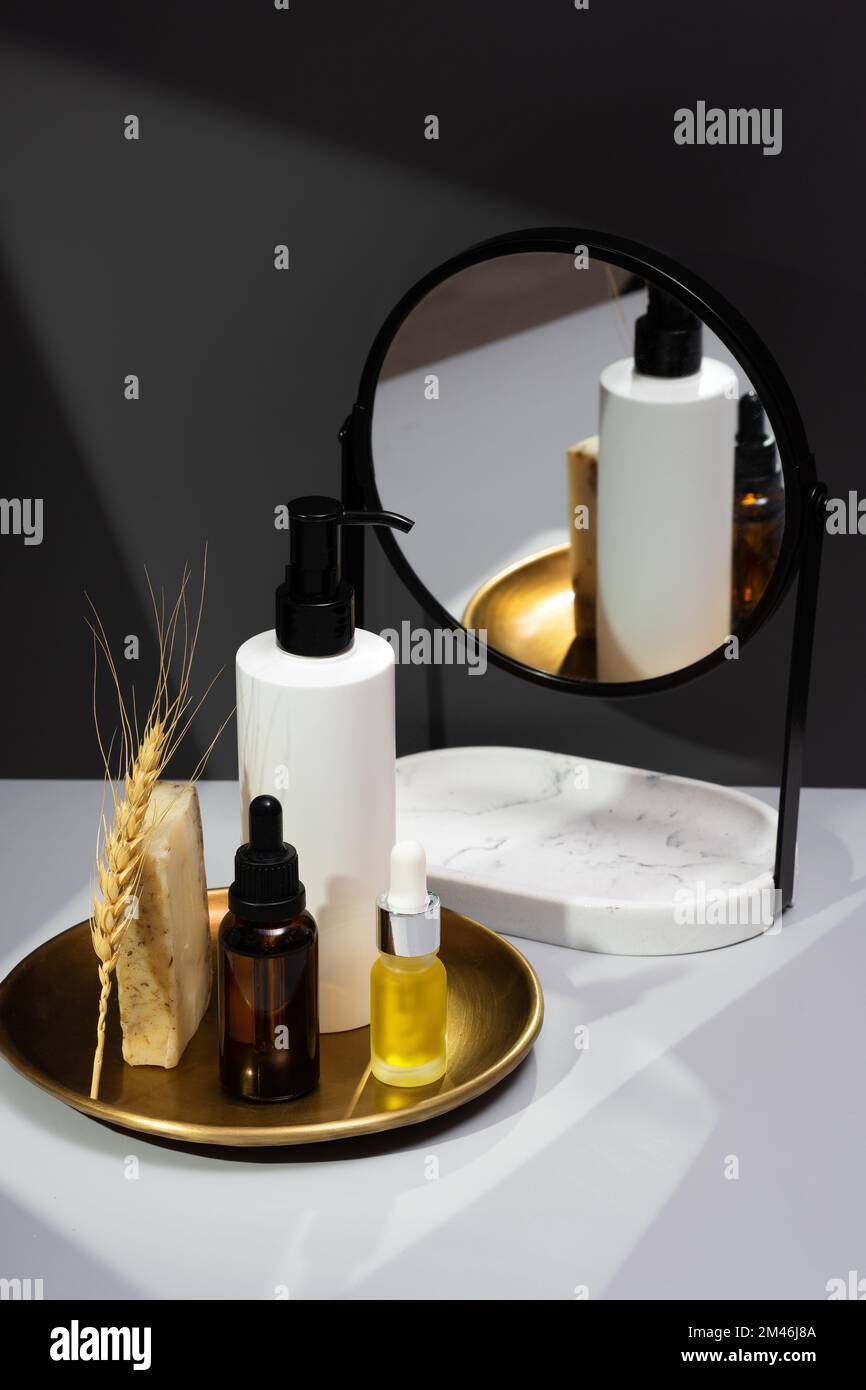 Creative still life with organic cosmetics. Set of essential oils ...