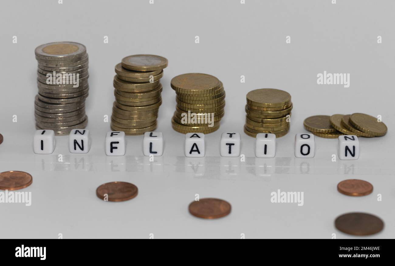 Stack of money coins with writing inflation in front of it Stock Photo ...