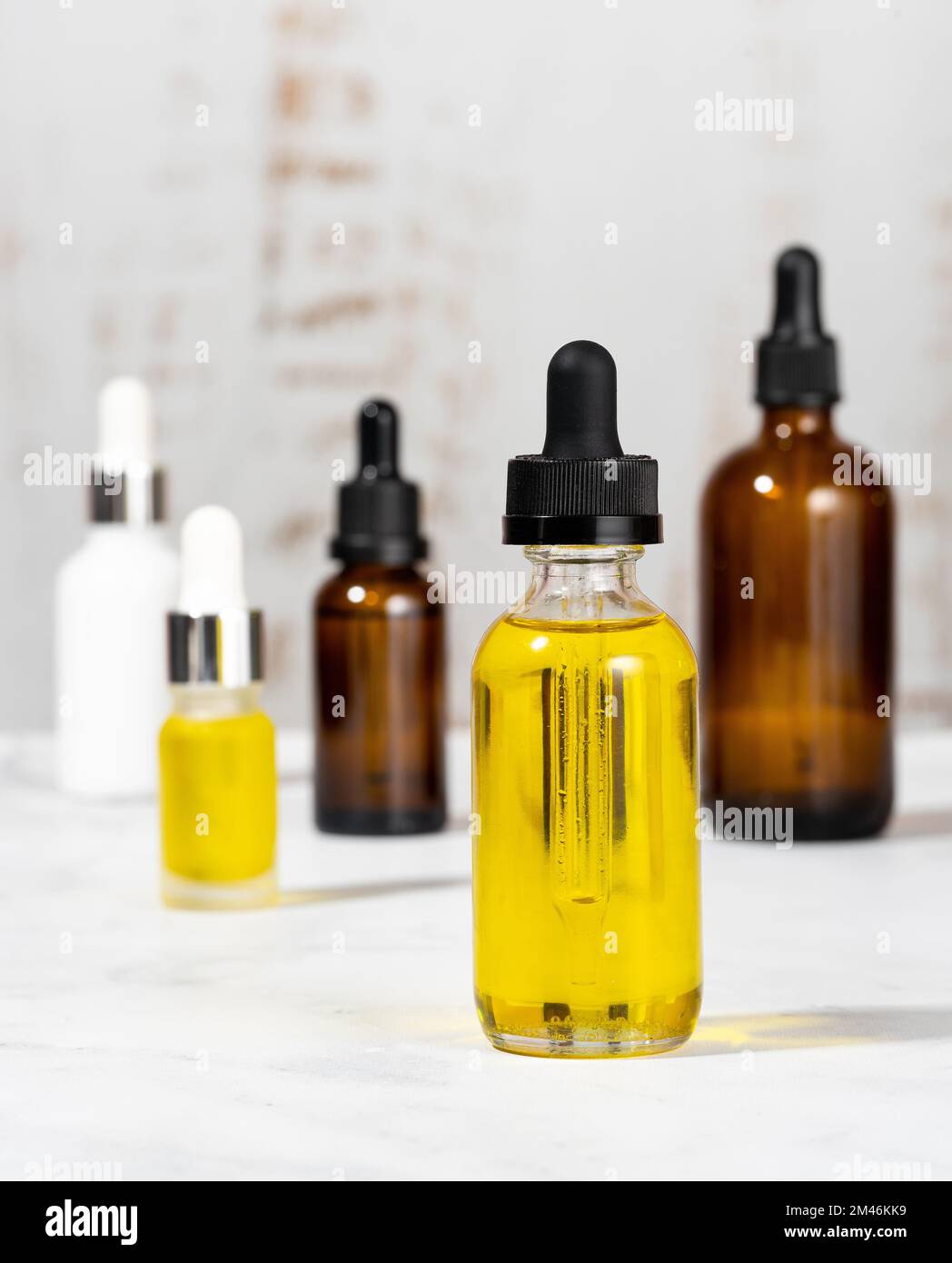 A set of organic cosmetics in glass vials with dropper for skin and ...