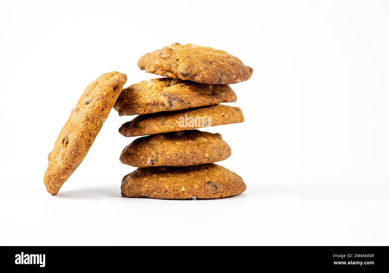 stack of home made irregular shaped cocnut and chocolate chip cookies ...