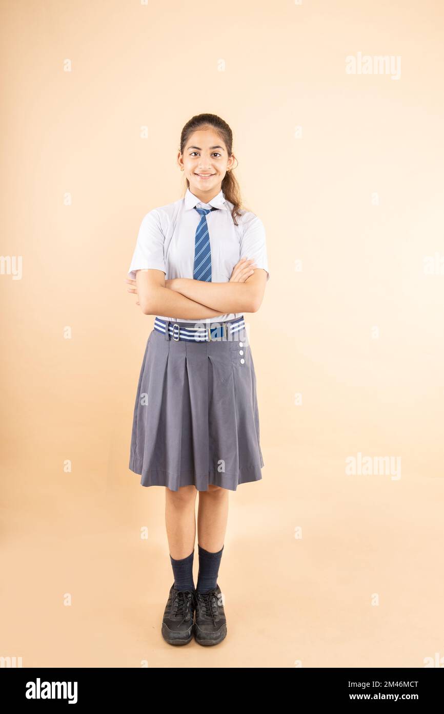 Happy confident Indian student schoolgirl wearing school uniform ...