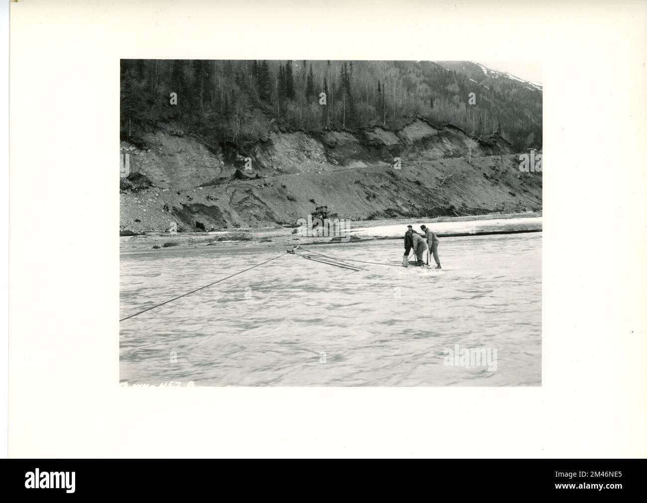 Second of three views of men crossing the White River on a raft ferry ...