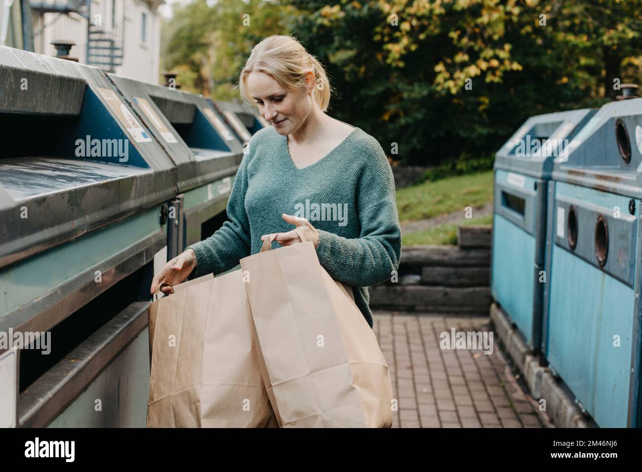 Woman recycling rubbish Stock Photo - Alamy