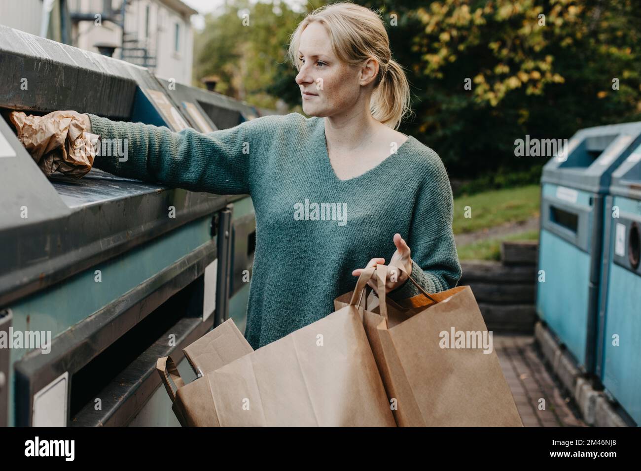 Woman recycling rubbish Stock Photo - Alamy