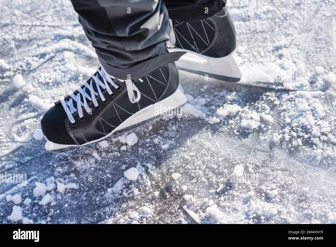Close-up of feet in ice skates Stock Photo - Alamy