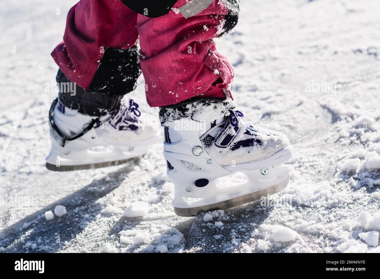 Close-up of feet in ice skates Stock Photo - Alamy