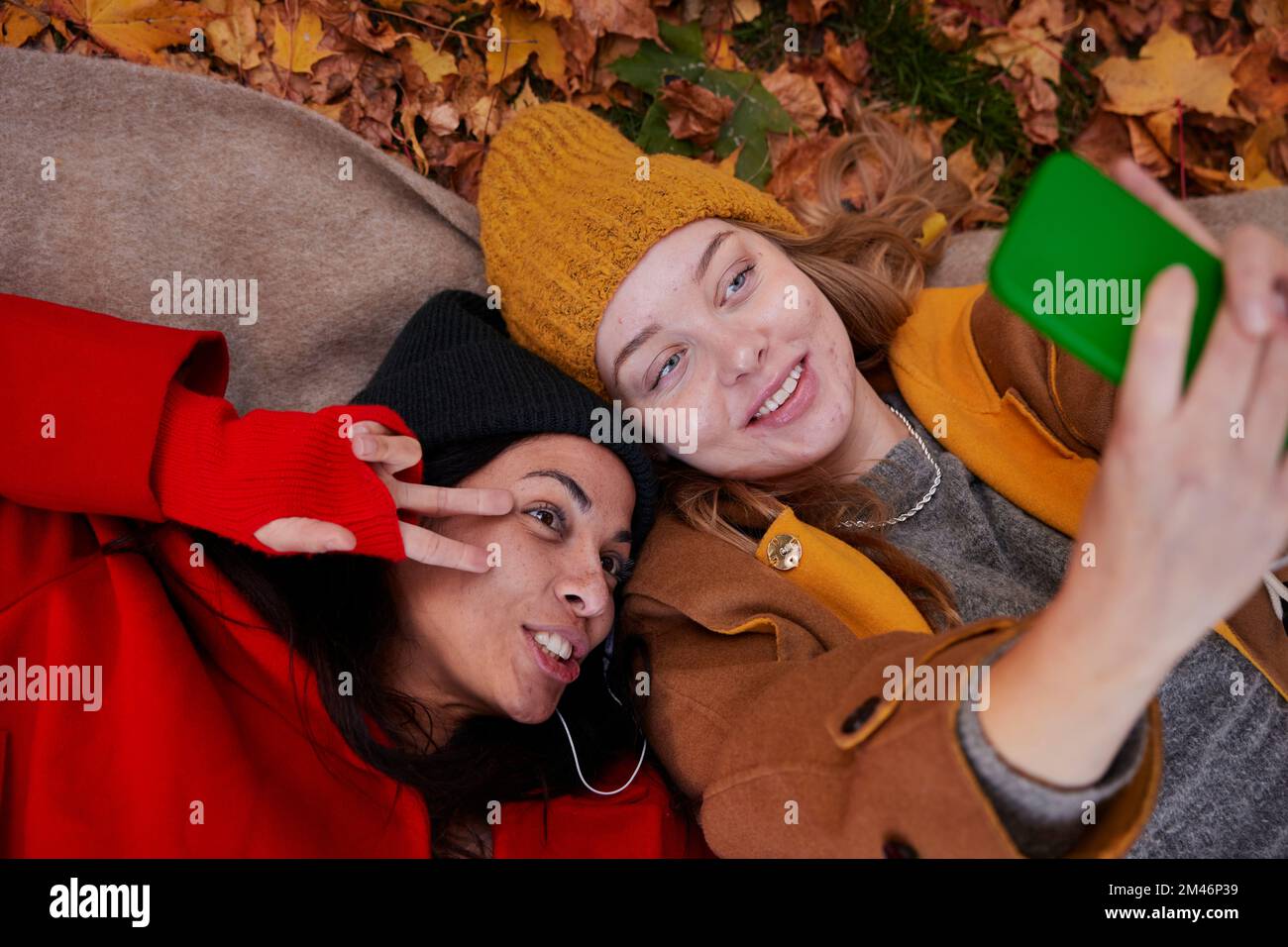 Two friends lying on ground hi-res stock photography and images - Alamy