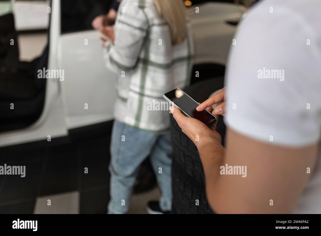 Customer in car dealership office Stock Photo - Alamy