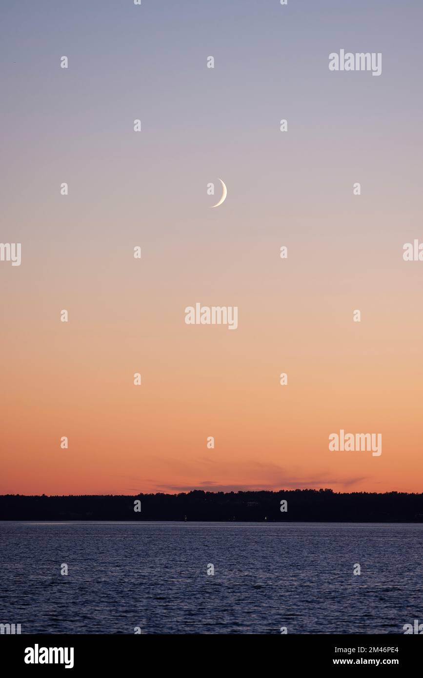 Crescent moon over sea hi-res stock photography and images - Alamy