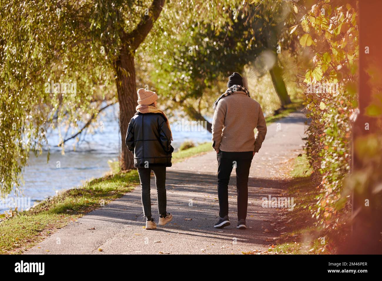 Woman walking in autumn park hi-res stock photography and images - Alamy