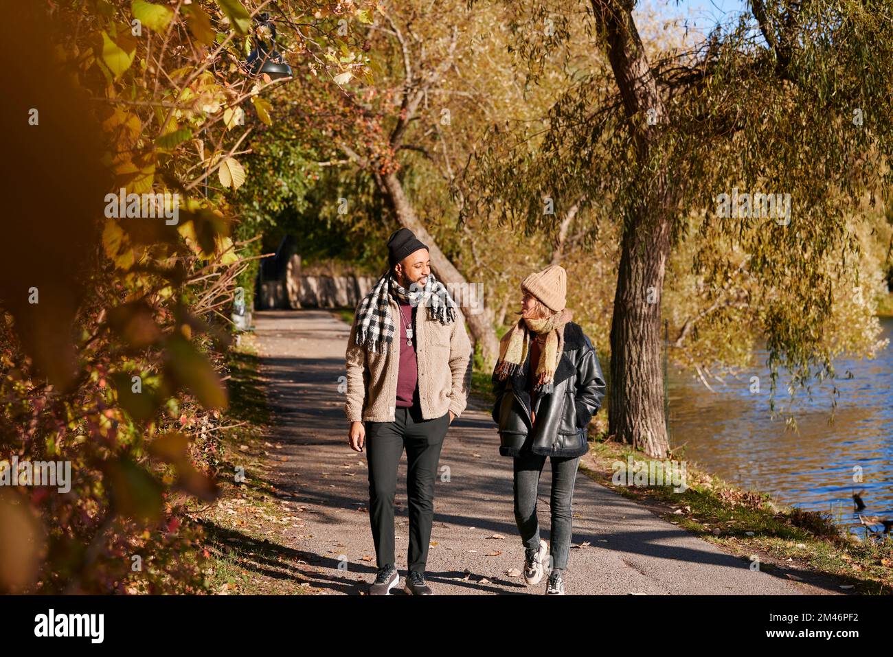 Woman walking in autumn park hi-res stock photography and images - Alamy