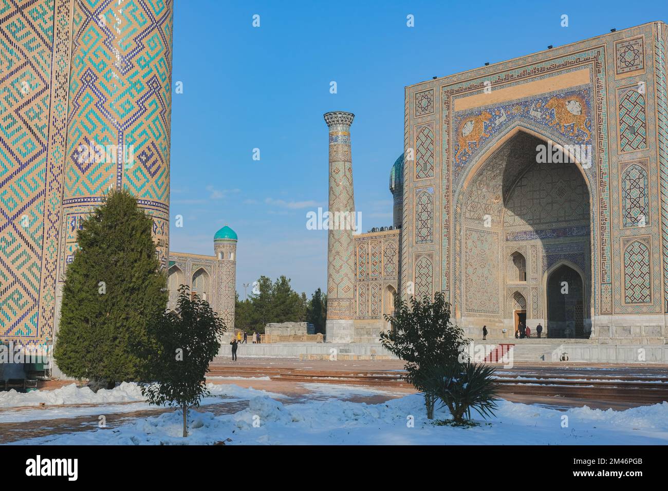 View of an Arab madrasah with lions in winter. at Registan Square in ...