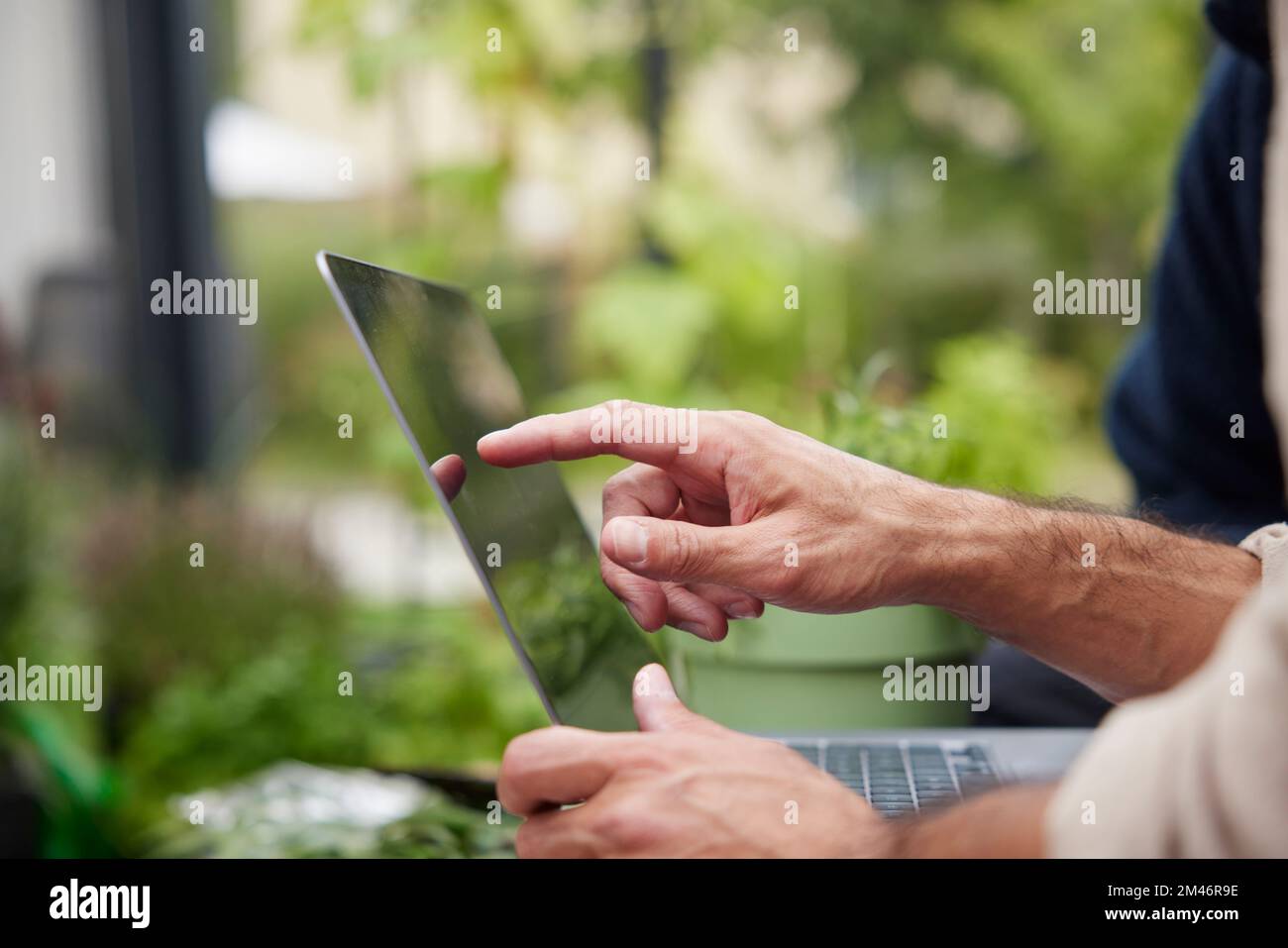 Hand pointing at laptop screen Stock Photo - Alamy