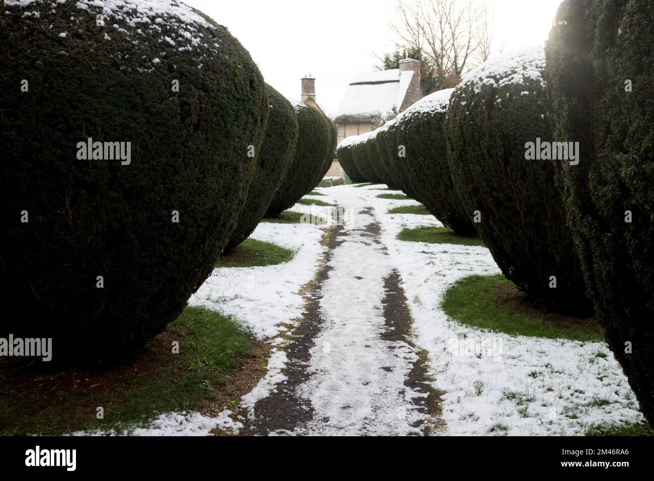 Pathway to St Peter and St Paul’s Church in winter, Long Compton ...