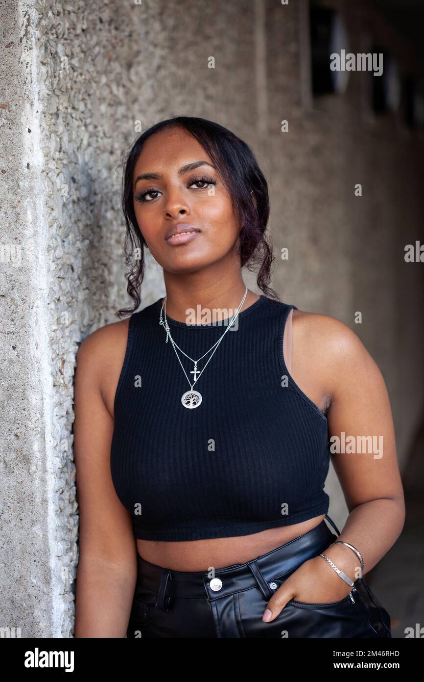 Young woman looking at camera Stock Photo - Alamy