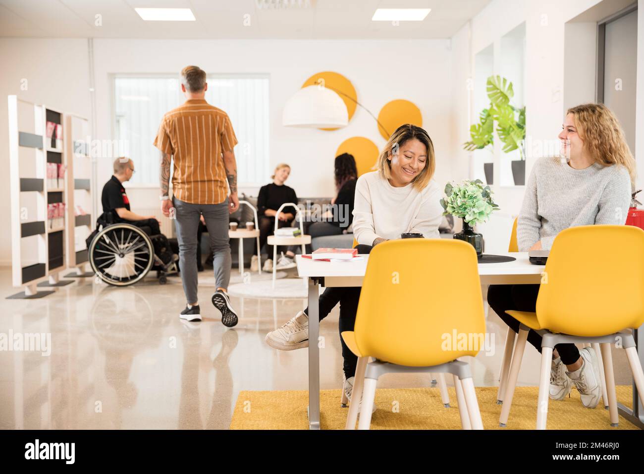 Students resting in cafeteria Stock Photo - Alamy