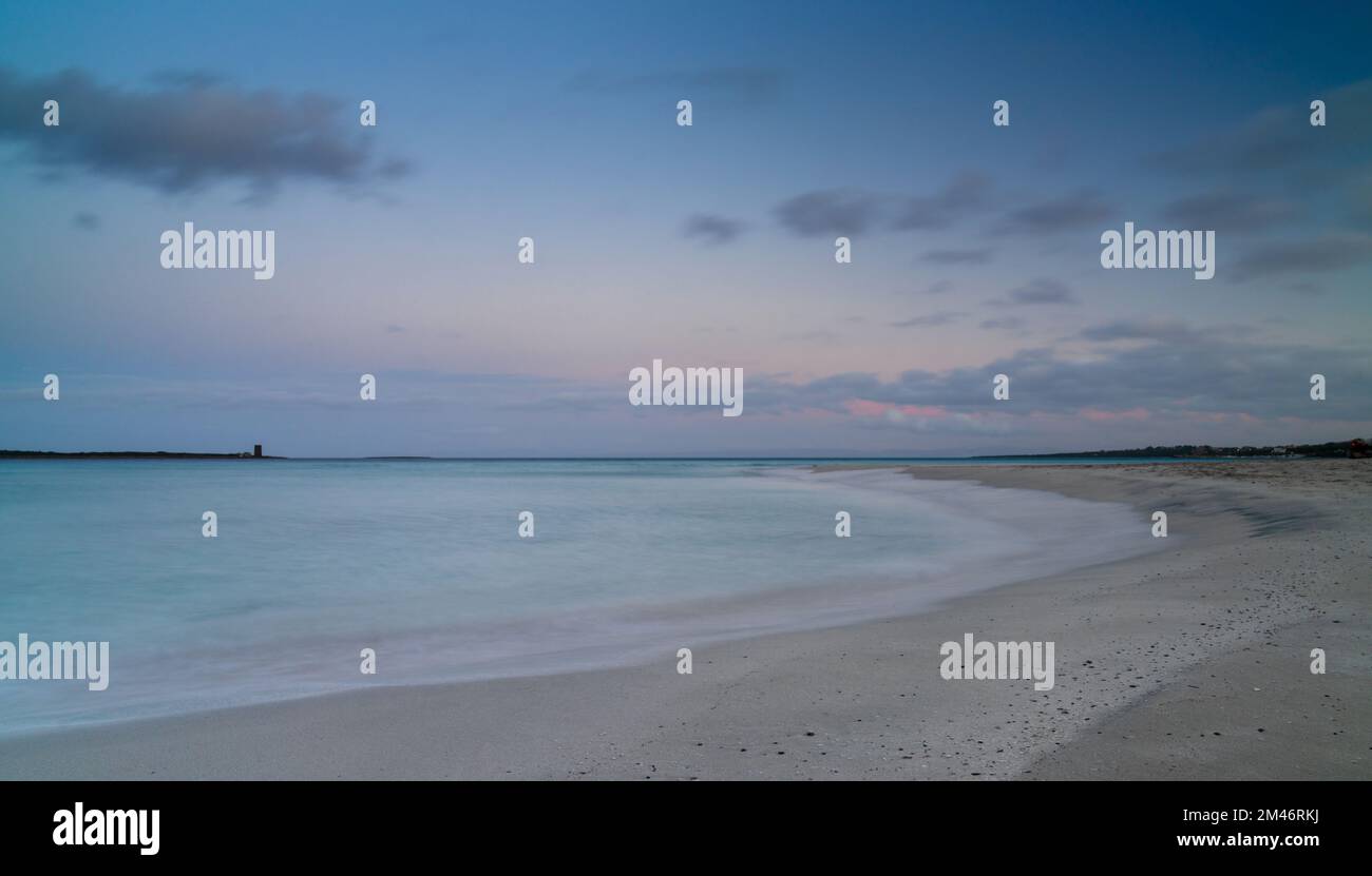 Colorful sunset over the picturesque white sand beach and turquoise ...