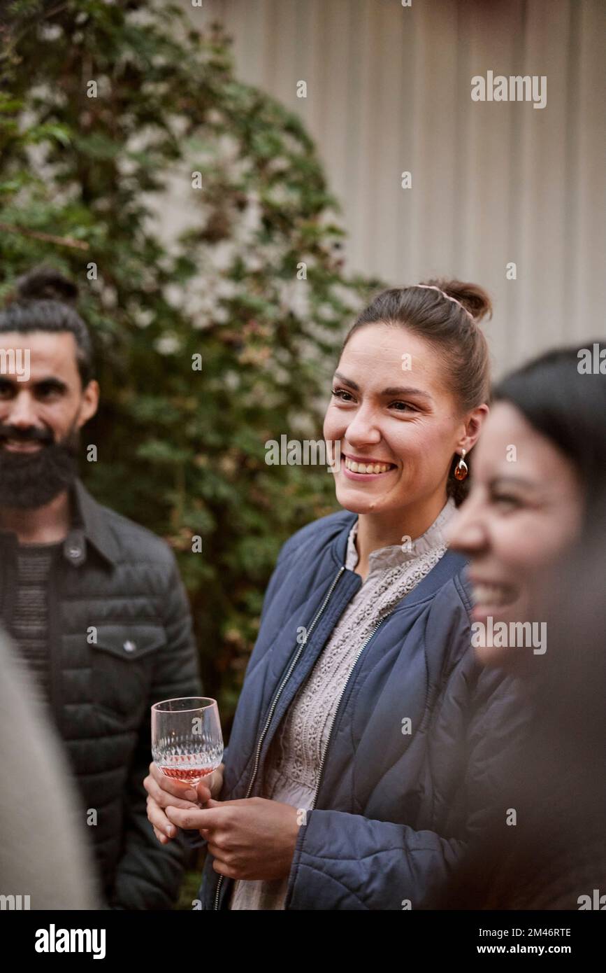 Cheerful positive friends speaking hi-res stock photography and images ...