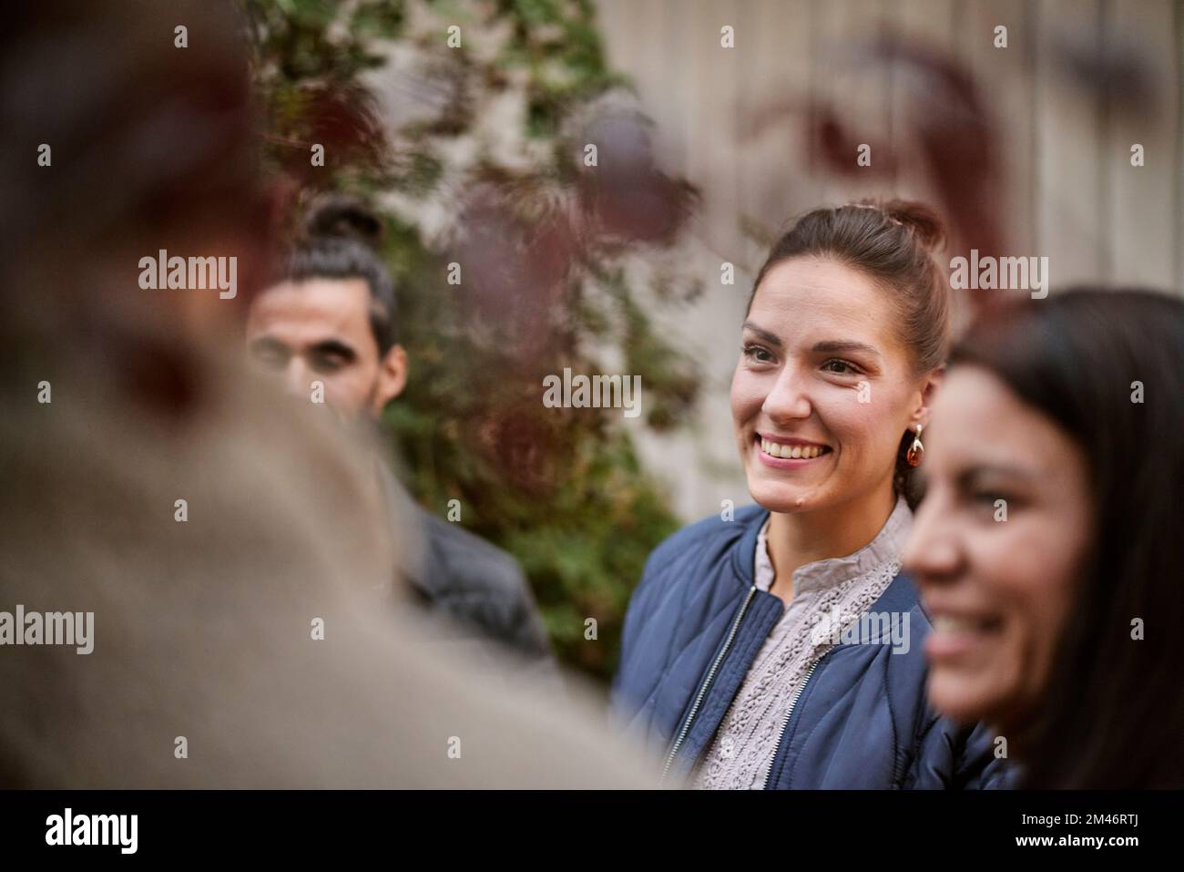 Cheerful positive friends speaking hi-res stock photography and images ...