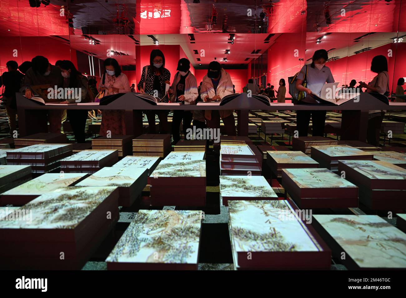 Beijing, China. 29th Sep, 2022. Visitors look at exhibits during an ...