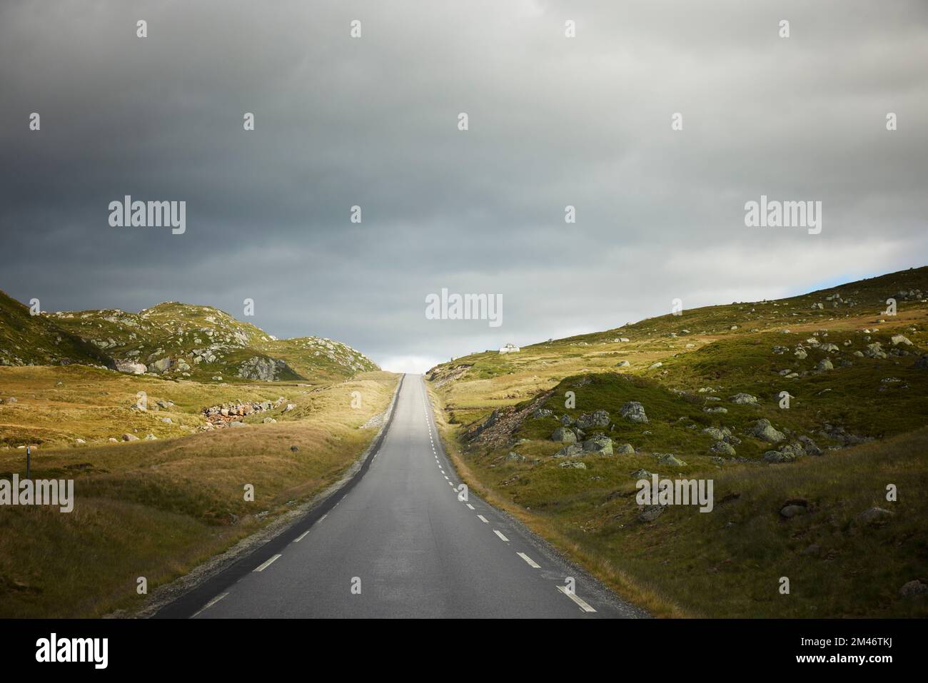 View of road through empty landscape Stock Photo - Alamy