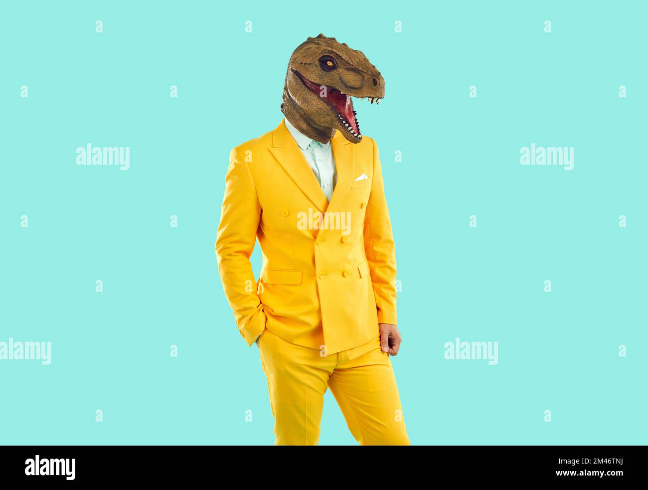Portrait of guy in funky yellow suit and funny T Rex mask posing on ...