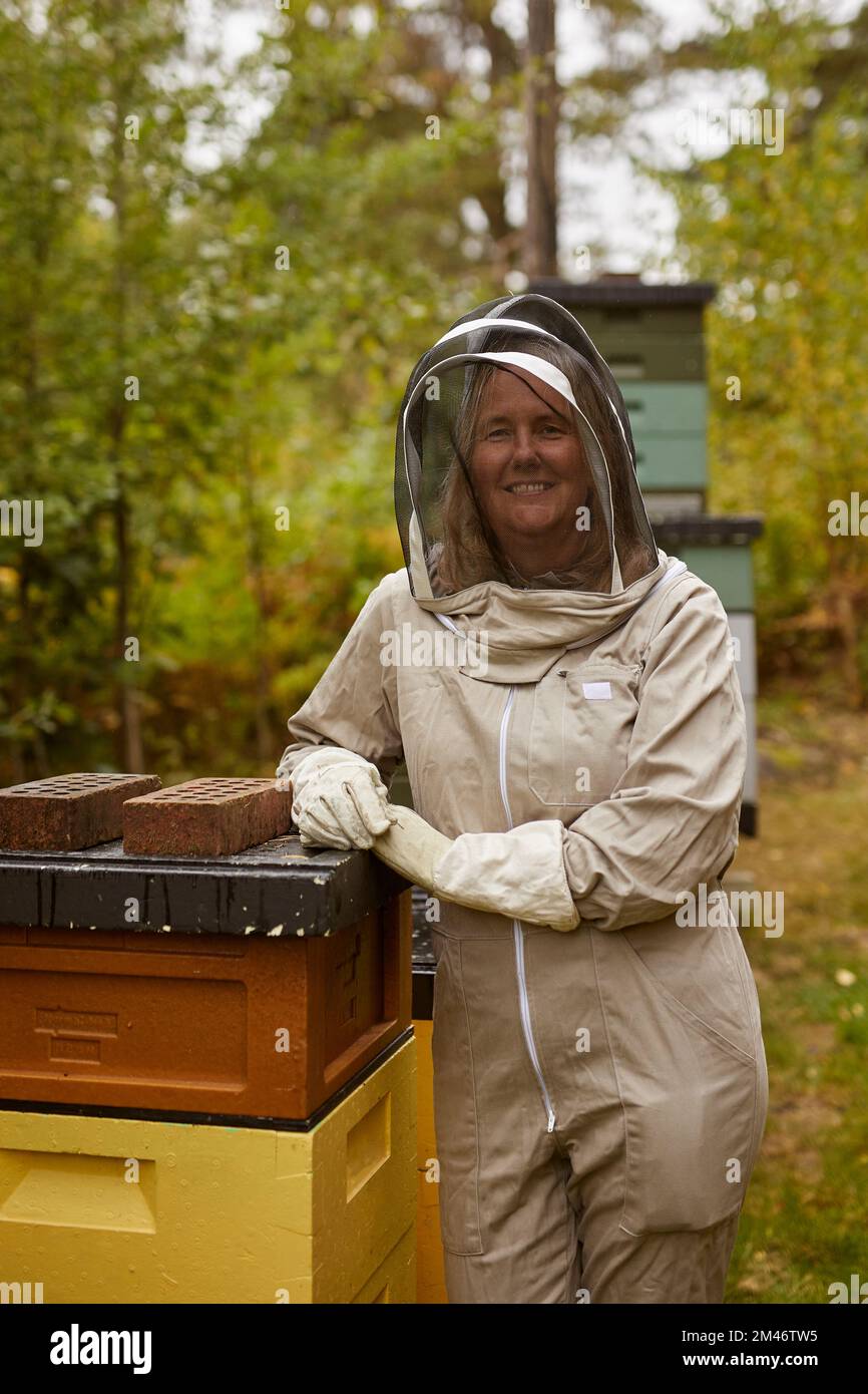 Bee-keeper posing during work Stock Photo - Alamy