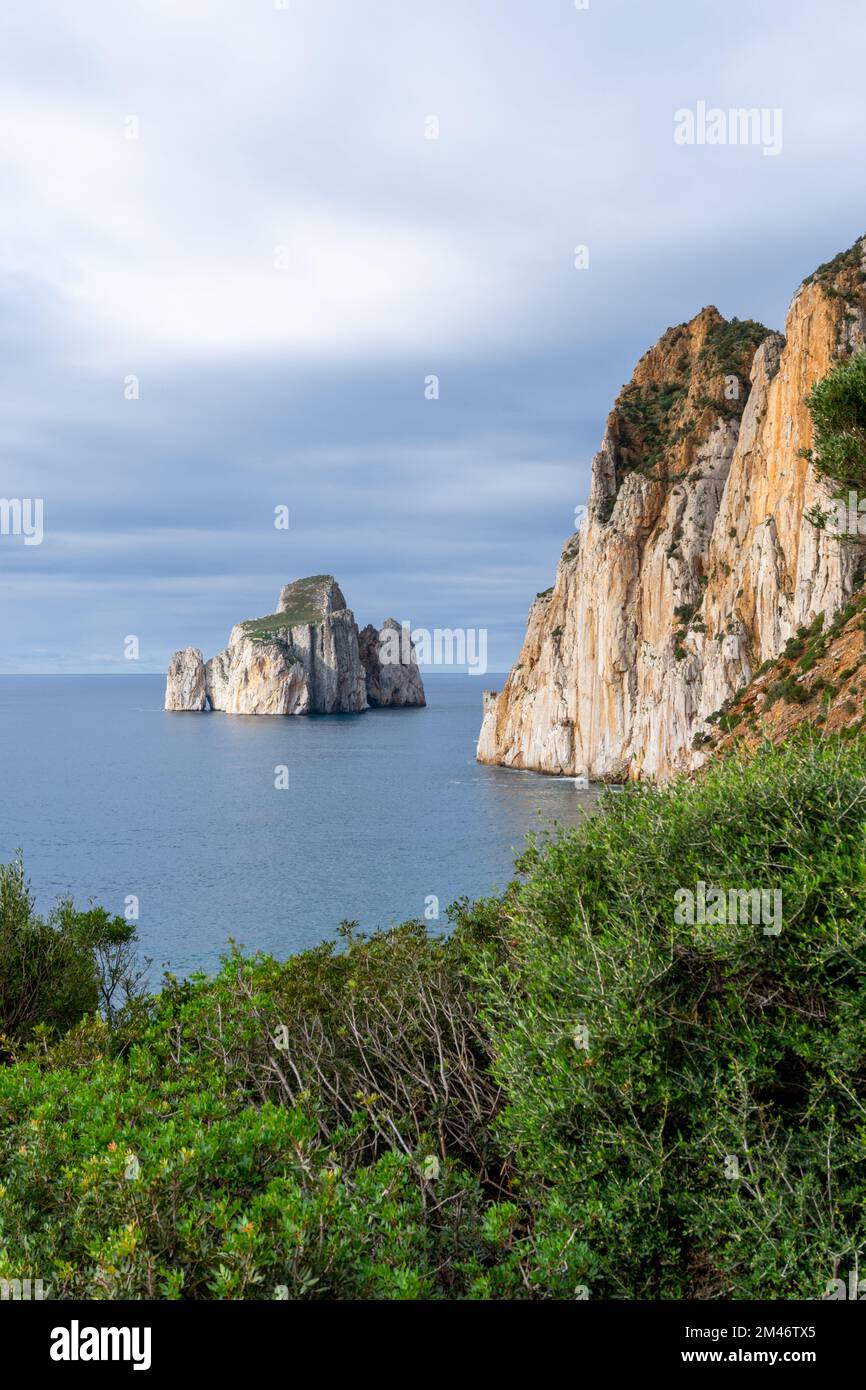 vertical landscape view of the cliffs and sea stacks at Porto Flavia on ...