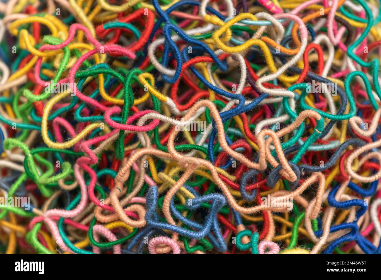 Thick multi-colored threads twisted together Stock Photo - Alamy