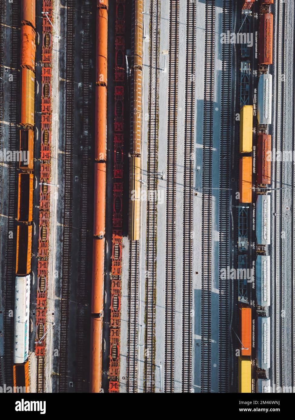 Birds eye view, vertical photo directly above cargo trains parked at ...