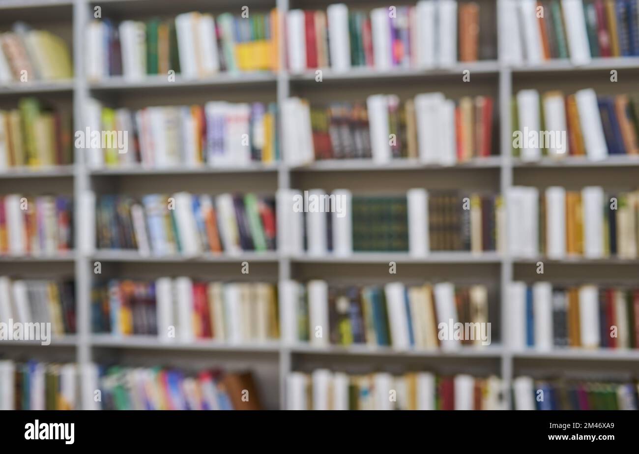 blurred bookshelf in library for your background design Stock Photo - Alamy