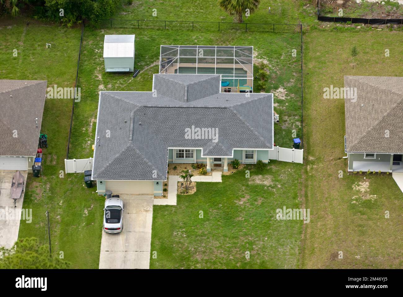 Aerial landscape view of suburban private houses between green palm ...