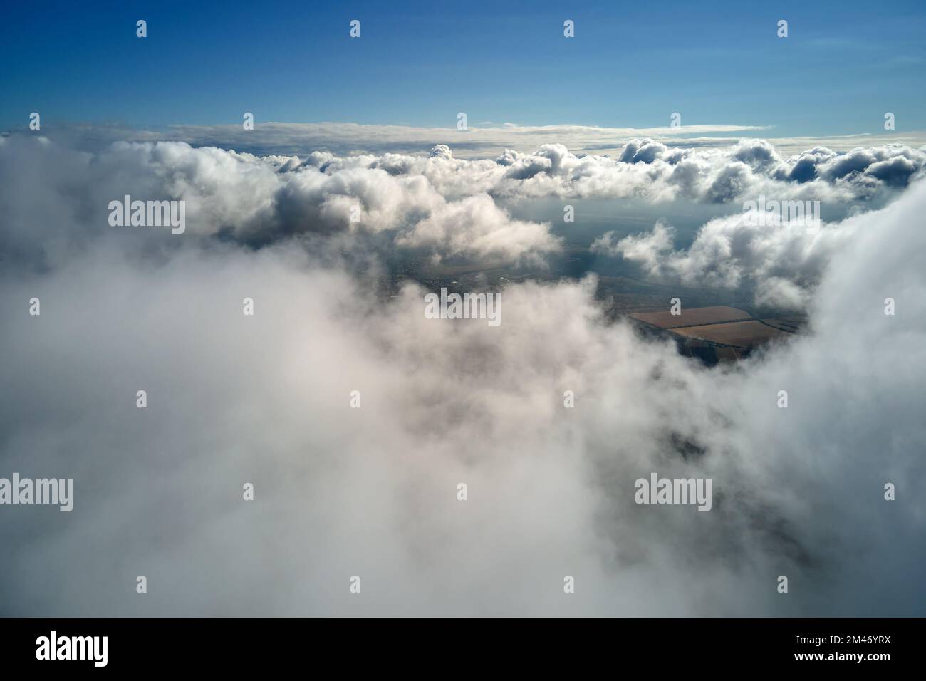 Aerial view from airplane window at high altitude of earth covered with ...