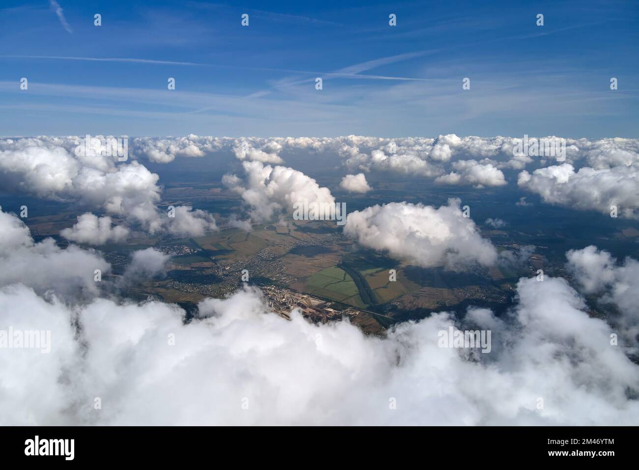 Aerial view from airplane window at high altitude of earth covered with ...