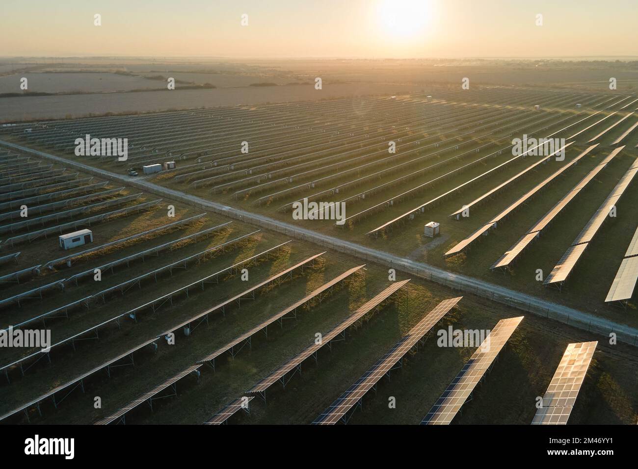 Aerial view of big sustainable electric power plant with many rows of ...