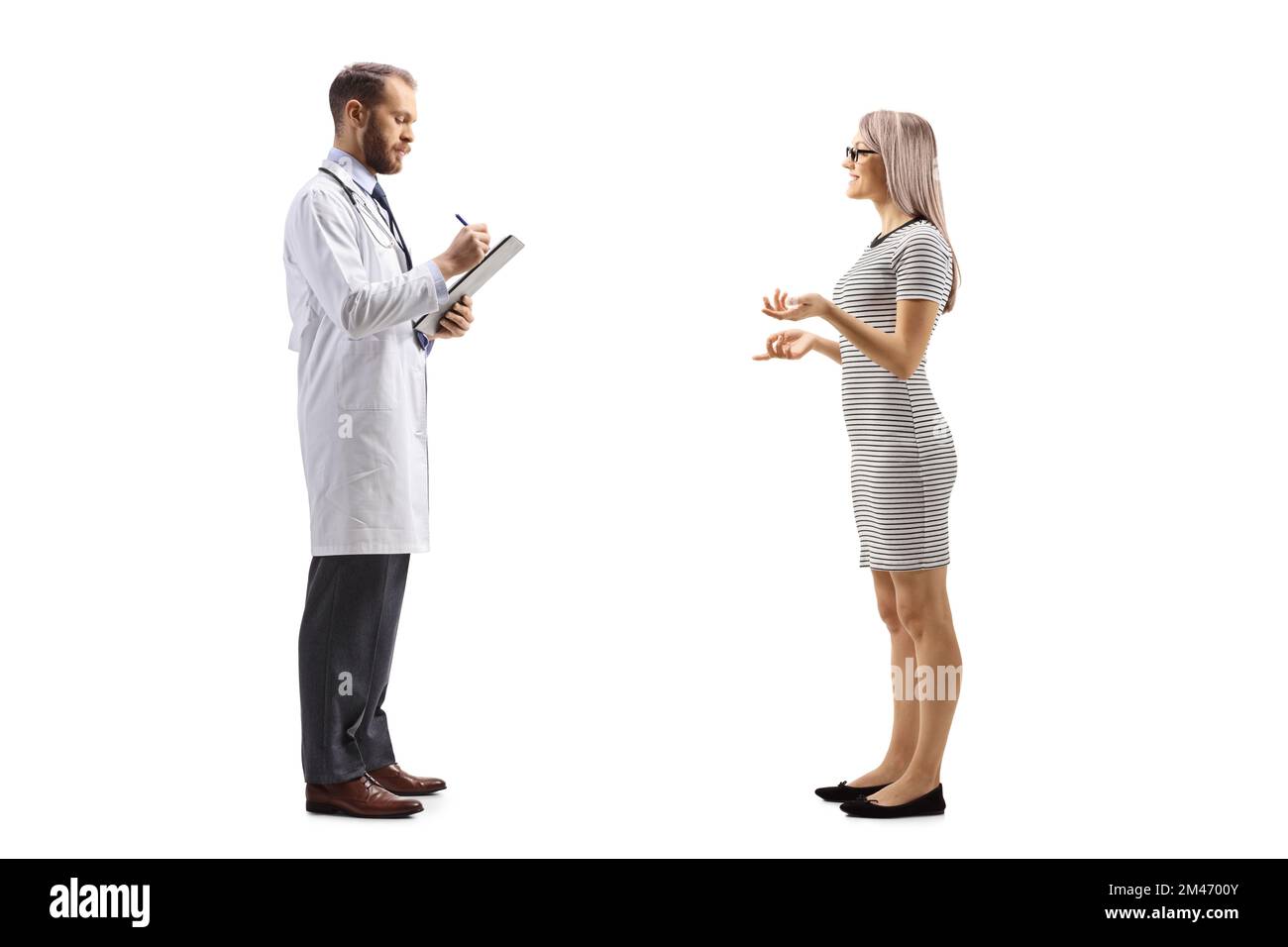 Young woman explaining something to a doctor isolated on white ...