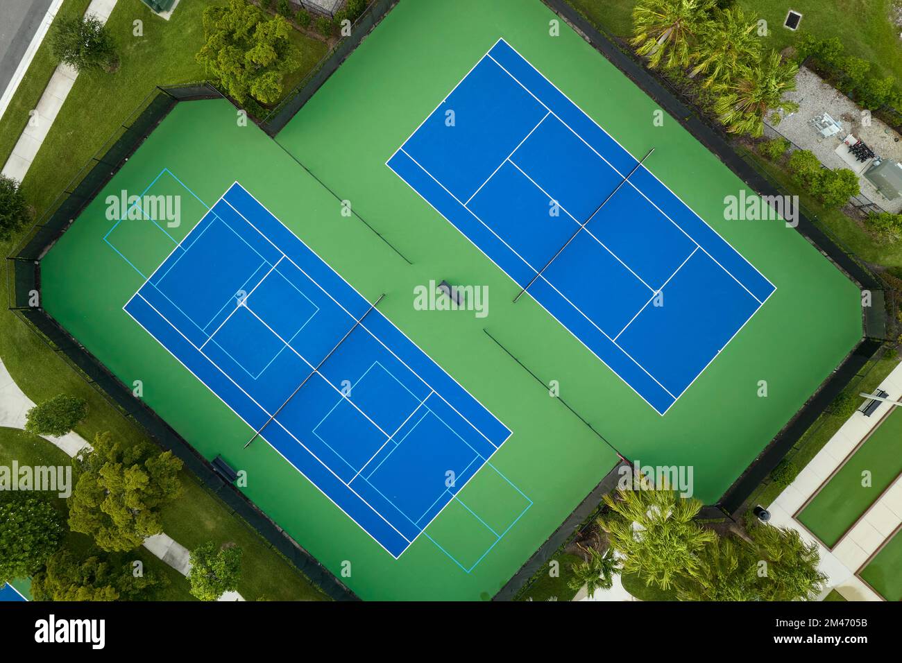 Aerial view of blue tennis courts for sports recreational activity ...