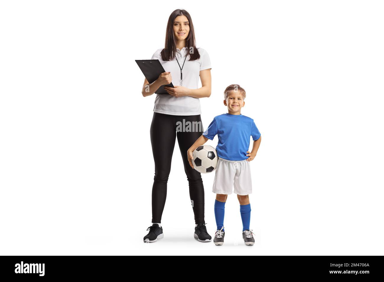 Boy with a football standing next to a female sports coach isolated on ...