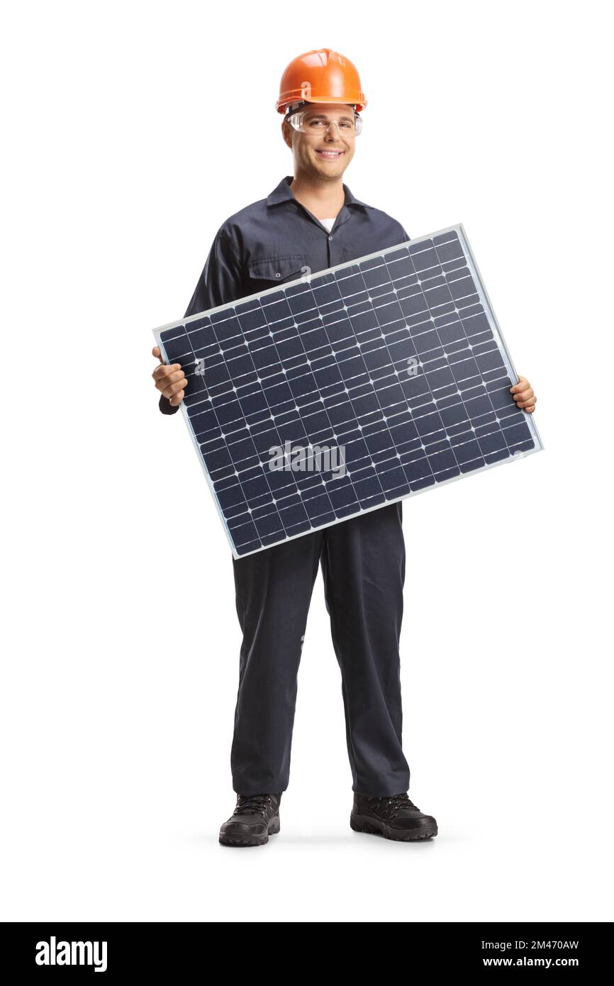 Worker in a uniform holding a solar panel isolated on white background ...