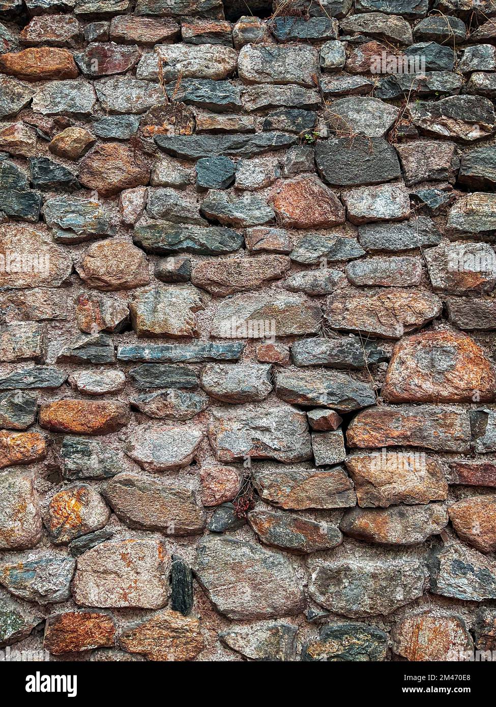 Stone wall close up, background or texture. Part of a large stone for ...