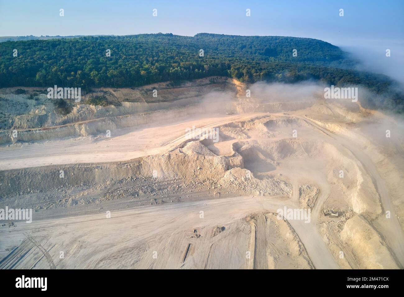Aerial view of open pit mining site of limestone materials extraction ...