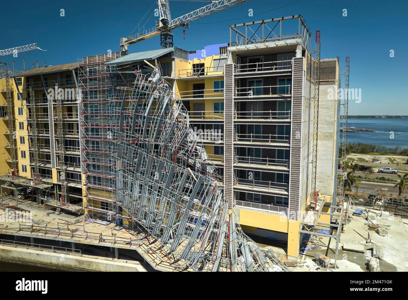 Aerial view of ruined by hurricane Ian construction scaffolding on high ...