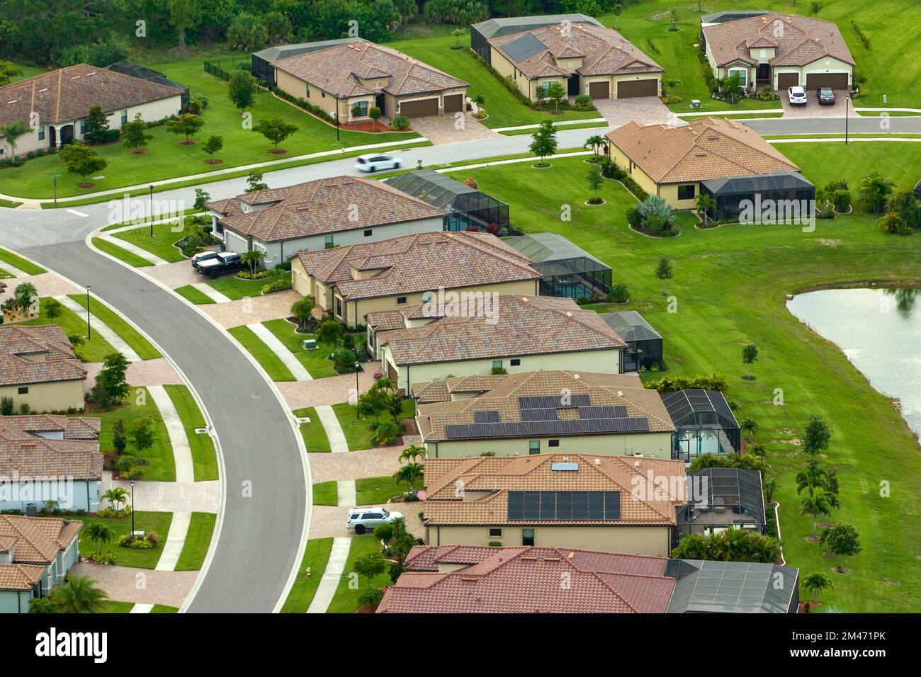 Aerial view of tightly located family houses in Florida closed suburban ...