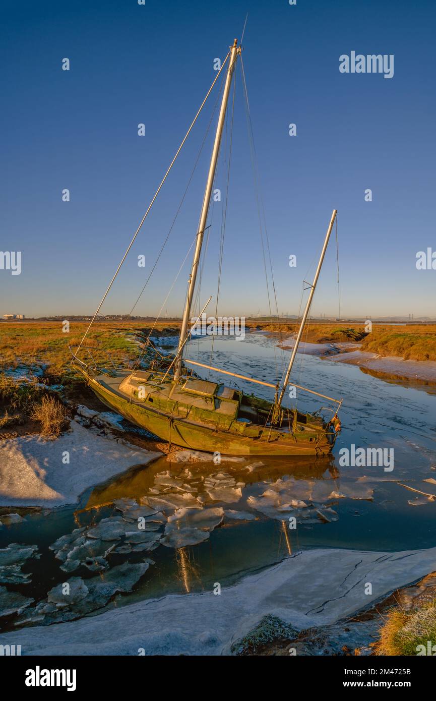 Wrecked yacht on the banks of the River Conder as it enters The Lune ...