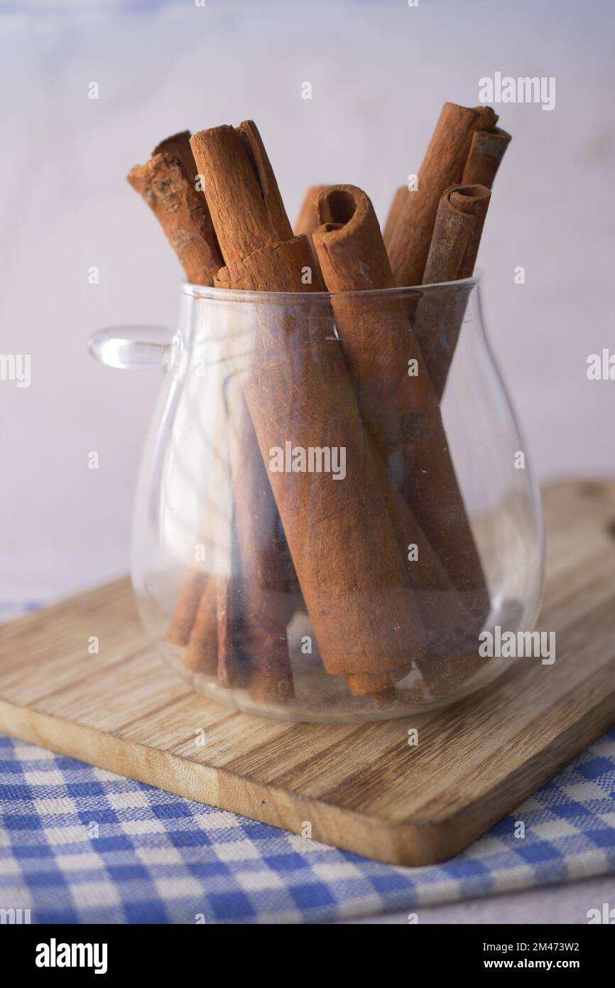 Cinnamon sticks in a transparent jar on table Stock Photo - Alamy
