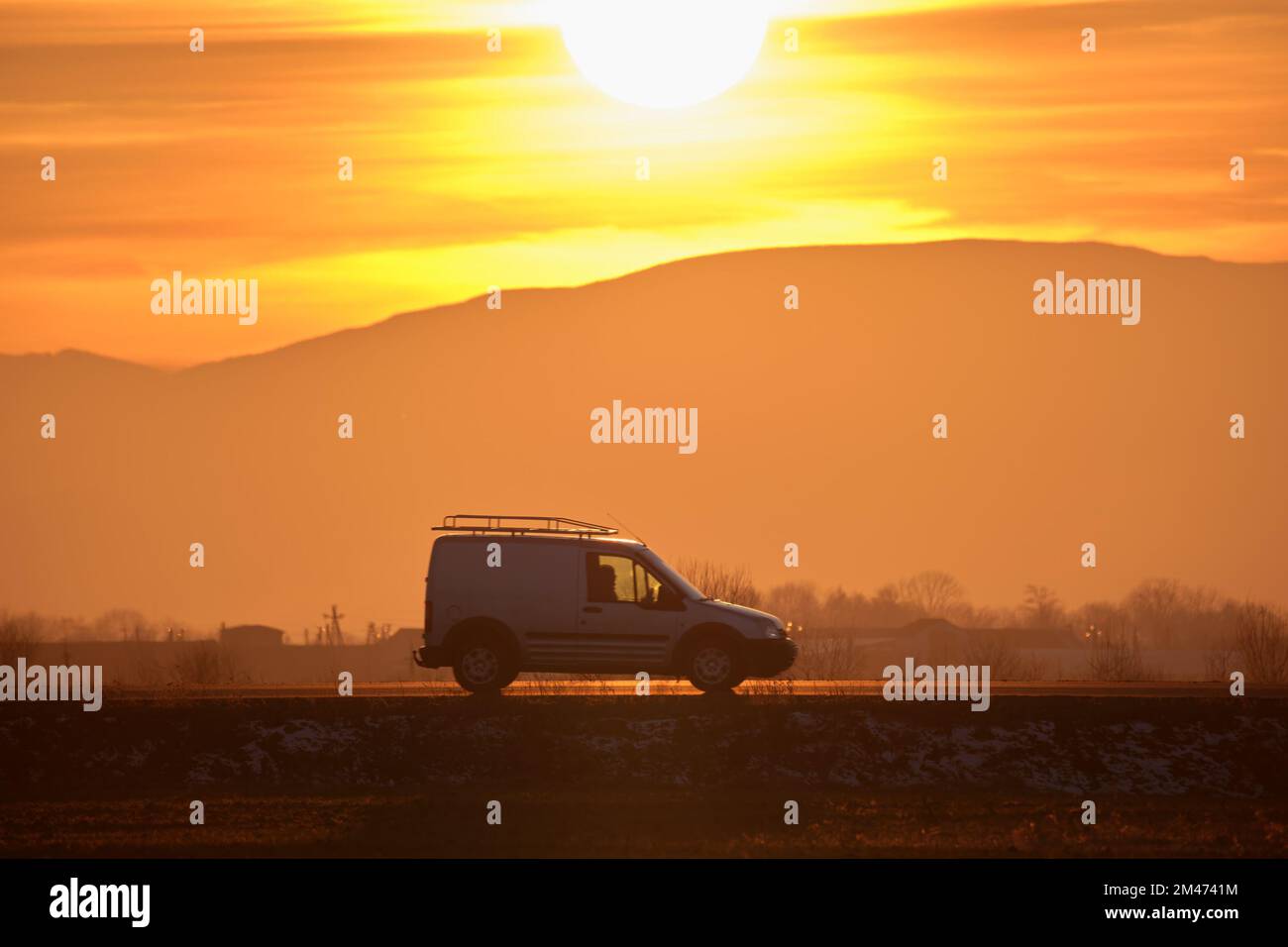 Small cargo van driving on highway hauling goods. Delivery ...