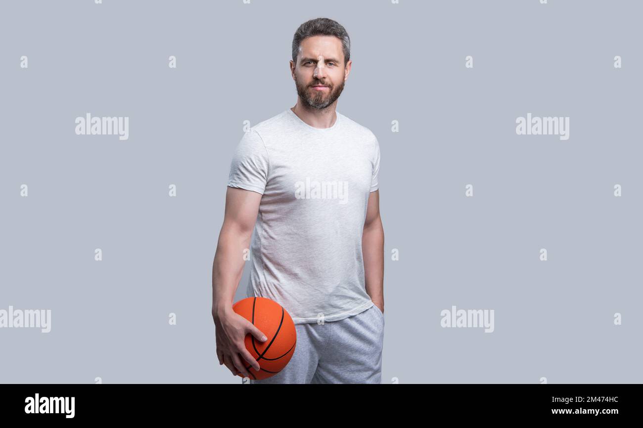 mature athlete basketball player isolated on grey background. athlete ...