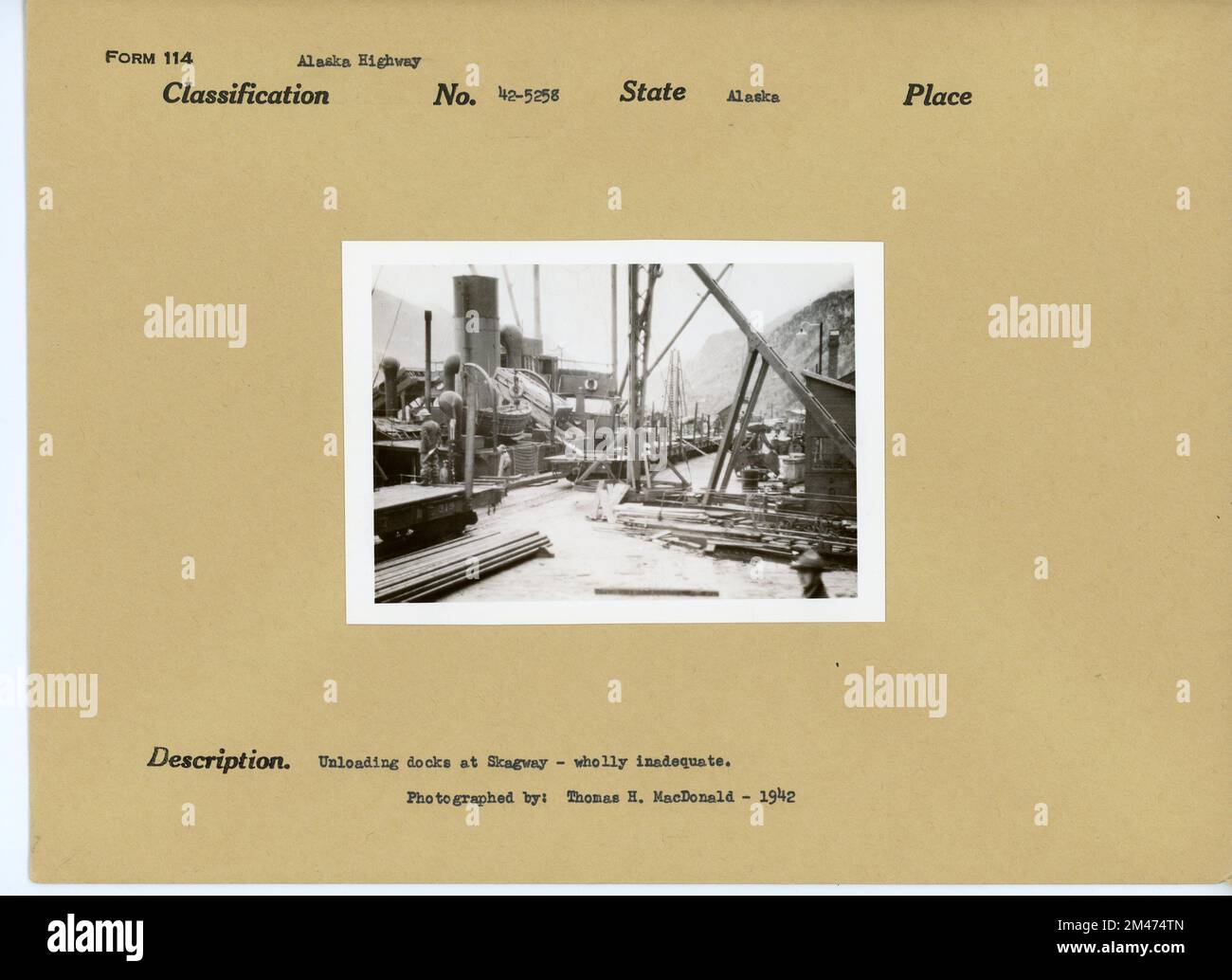 Building Alaska Highway. Original caption: Unloading docks at Skagway ...