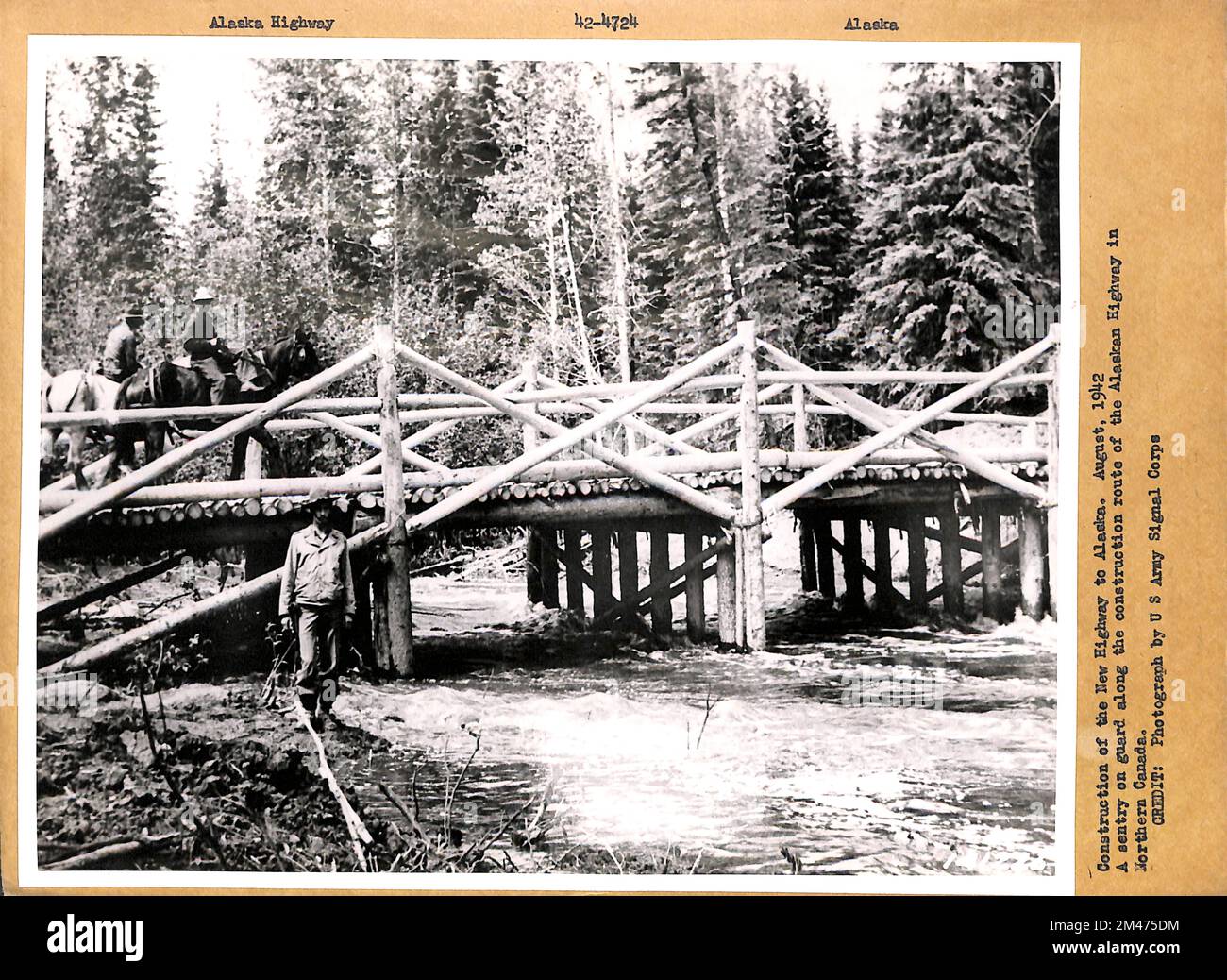 A sentry of guard along the construction route of the Alaska Highway in ...